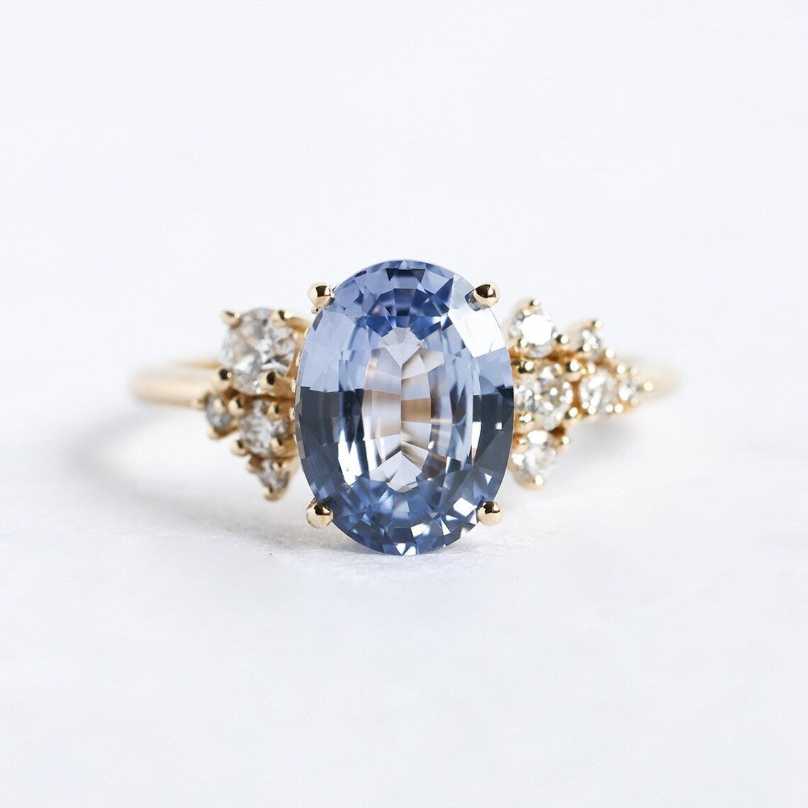 Nuria Oval Sapphire Ring With Diamond Clusters – Capucinne